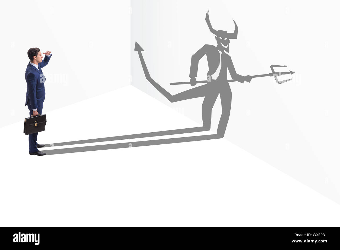 Devil hiding in the businessman - alter ego concept Stock Photo - Alamy