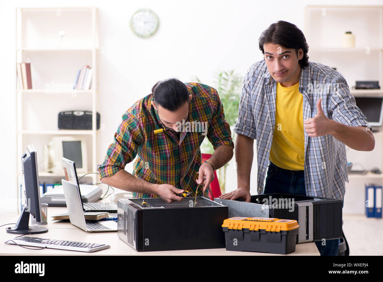 Two engineers working on computer hi-res stock photography and images ...
