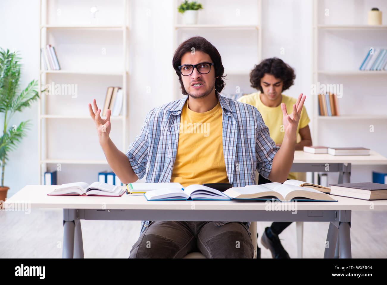 Two male students in the classroom Stock Photo - Alamy