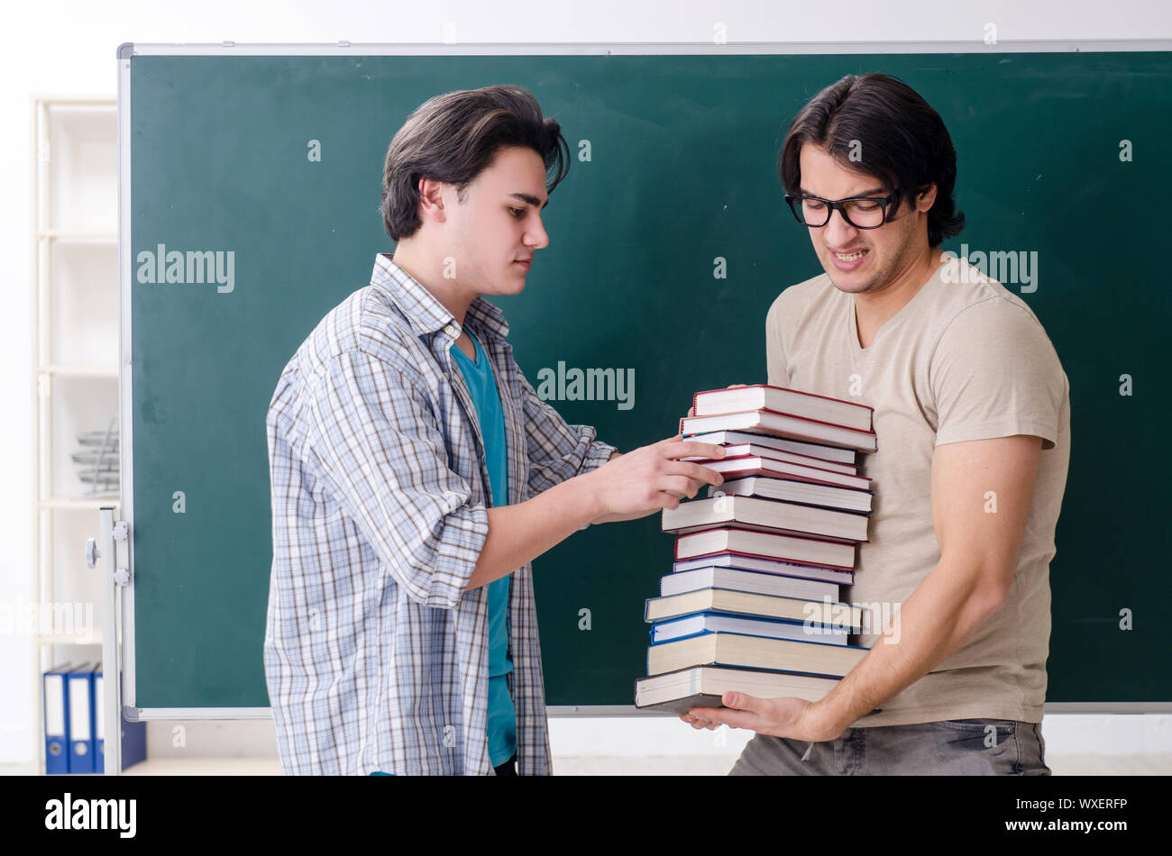 Two male students in the classroom Stock Photo - Alamy