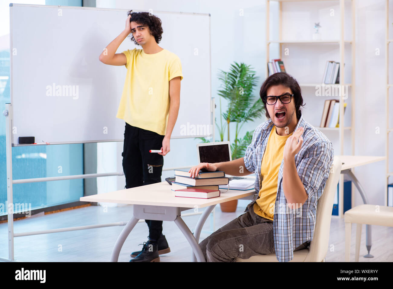 Two male students in the classroom Stock Photo - Alamy