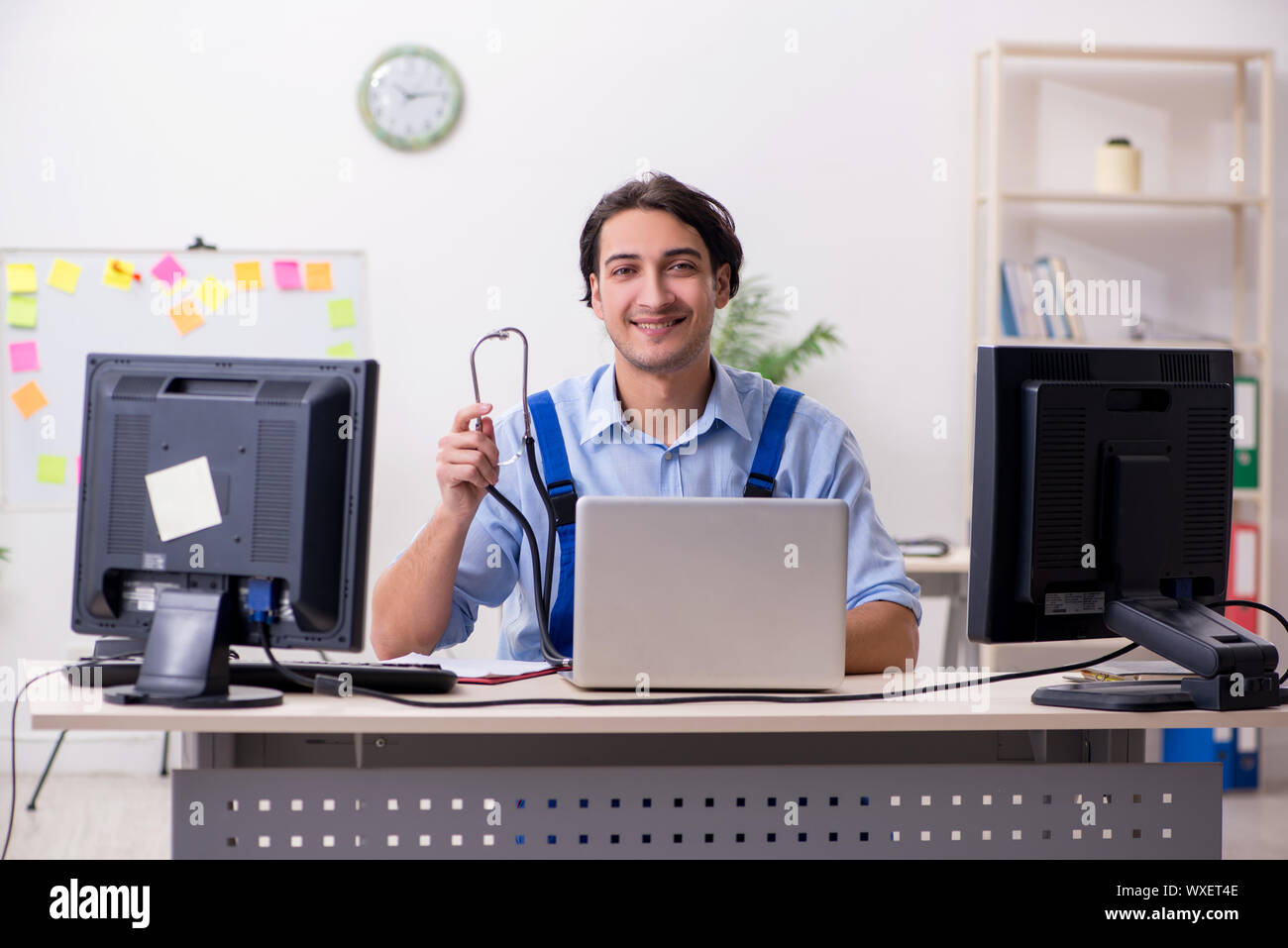 Male it specialist working in the office Stock Photo - Alamy
