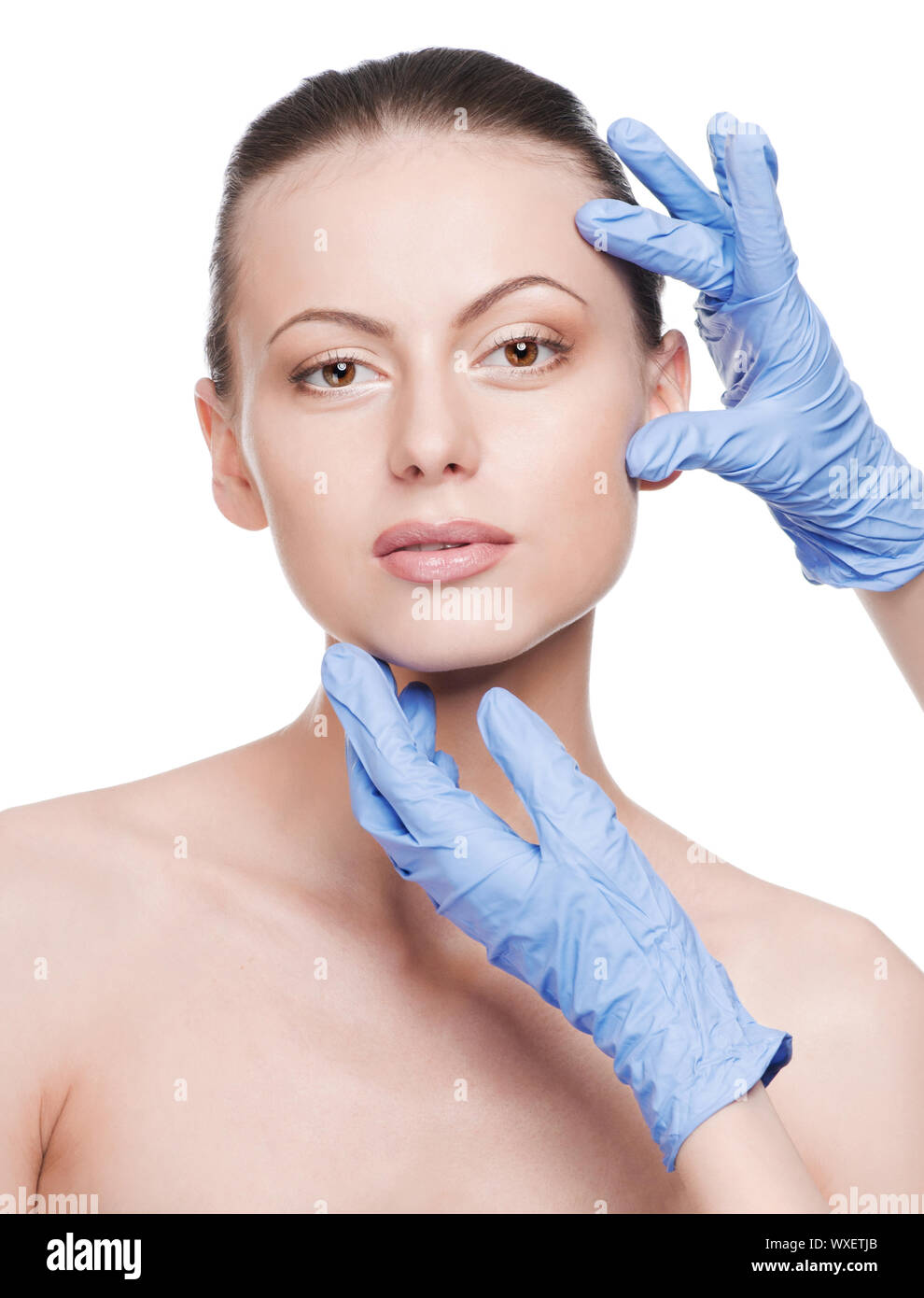 Beautician touch and exam health woman face. Plastic surgery. Isolated ...