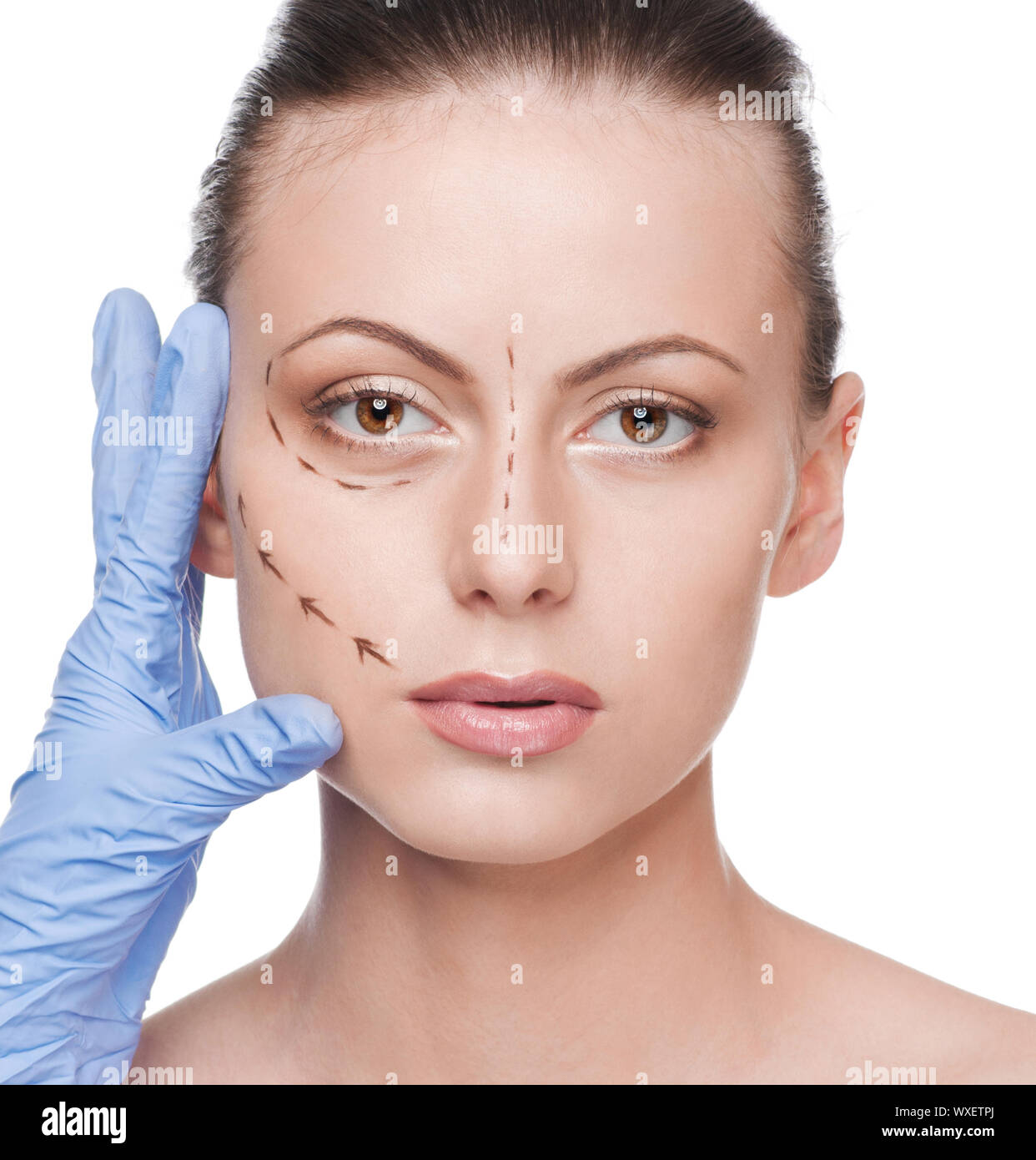 Beautician touch and draw correction lines on woman face. Before ...