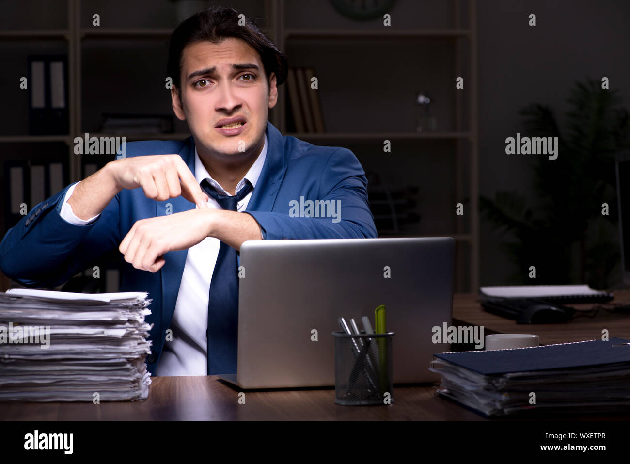 Checking laptop night time hi-res stock photography and images - Alamy