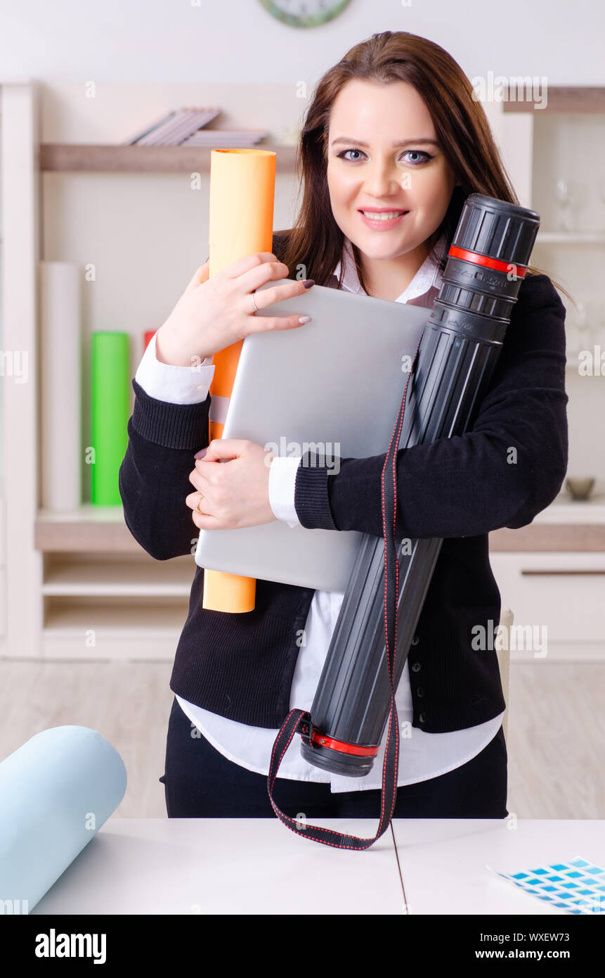 Female designer working in the office Stock Photo - Alamy