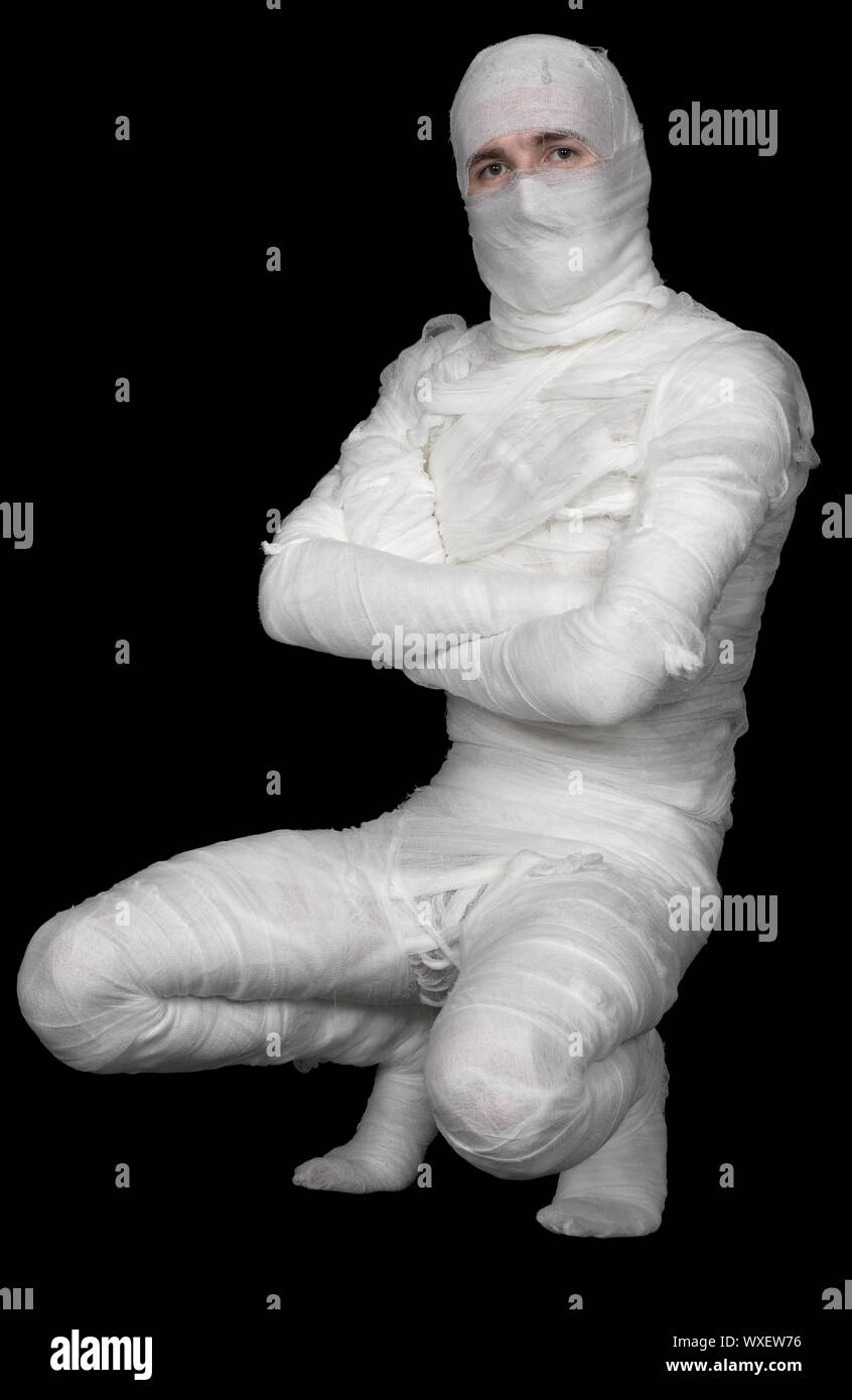 Man in costume of mummy on the black background Stock Photo - Alamy