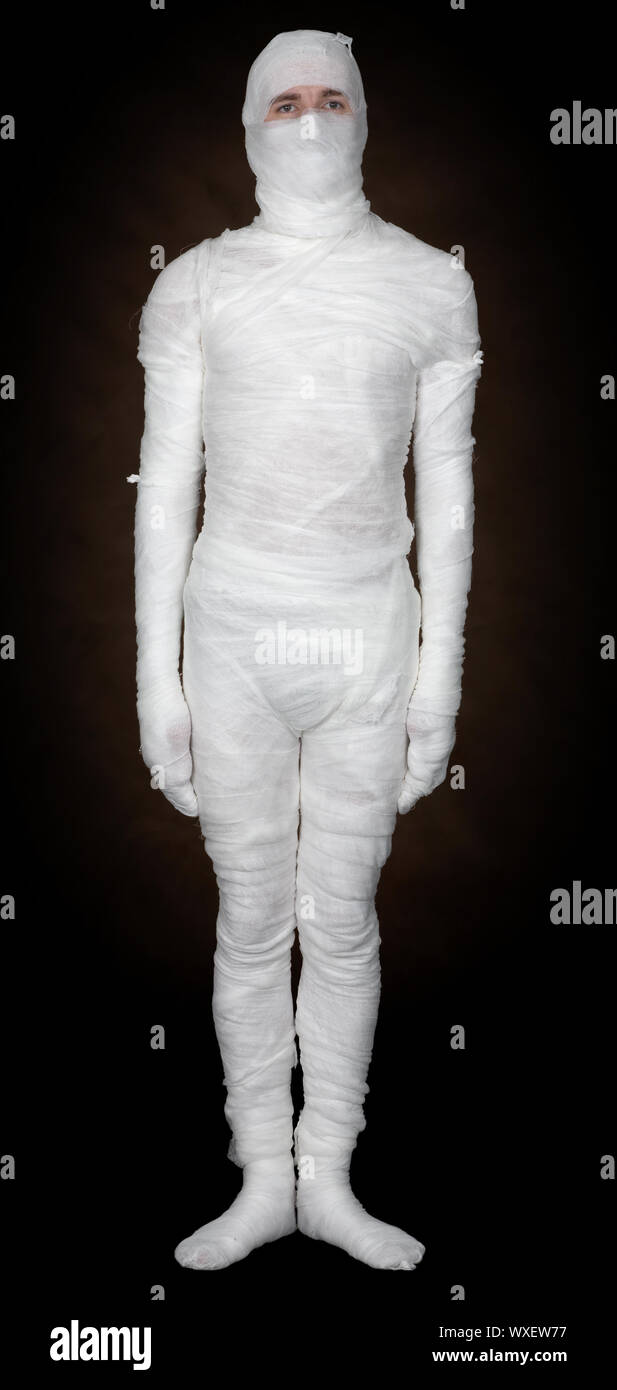 Man in bandage on the black background Stock Photo - Alamy