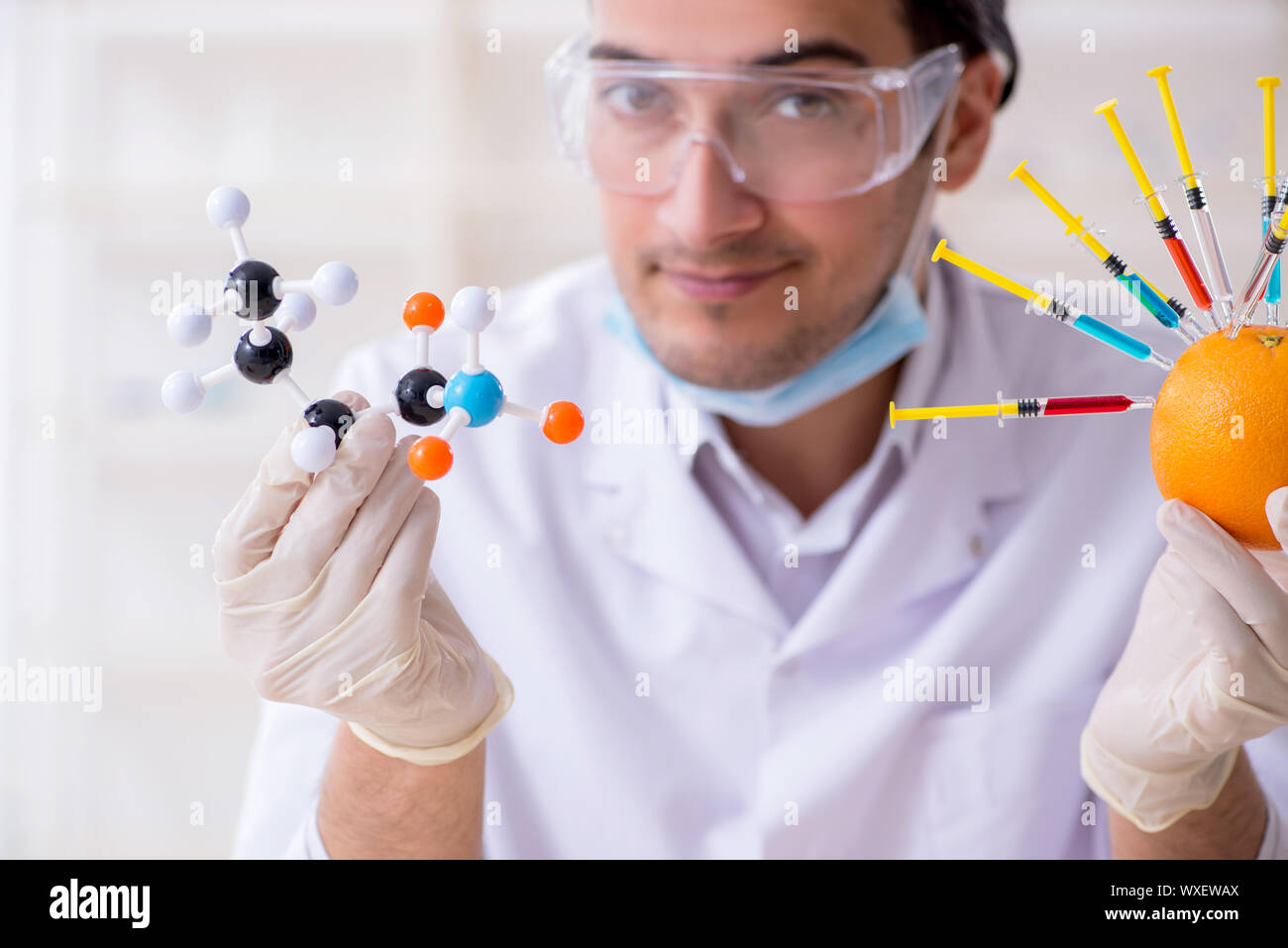 Male nutrition expert testing food products in lab Stock Photo - Alamy