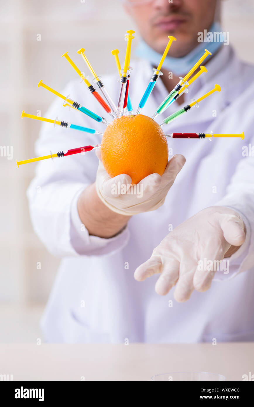 Male nutrition expert testing food products in lab Stock Photo - Alamy