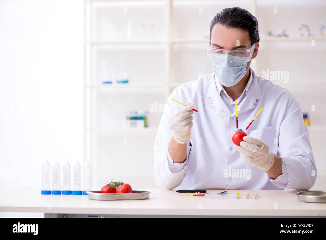 Male nutrition expert testing food products in lab Stock Photo - Alamy