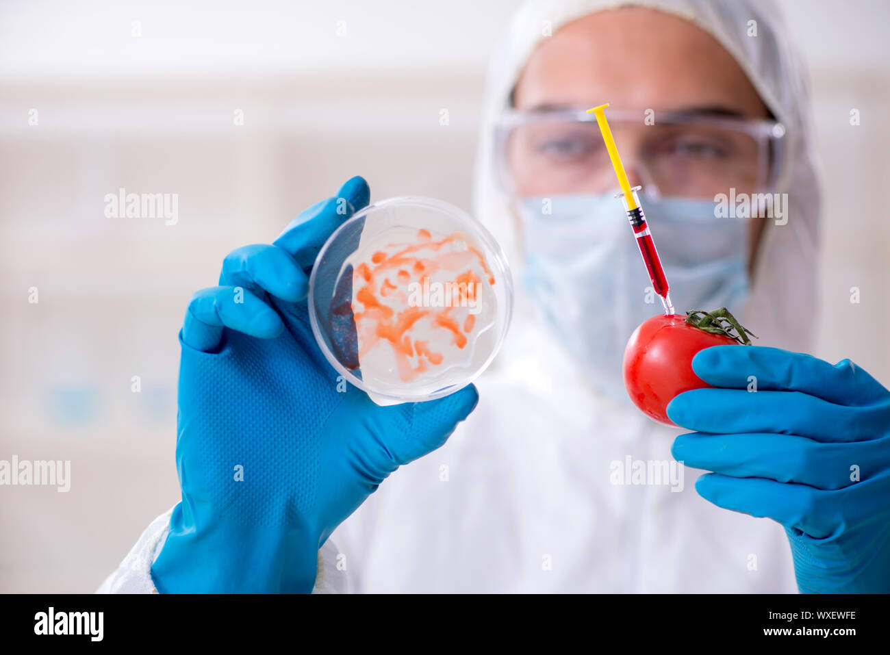 Male nutrition expert testing food products in lab Stock Photo - Alamy