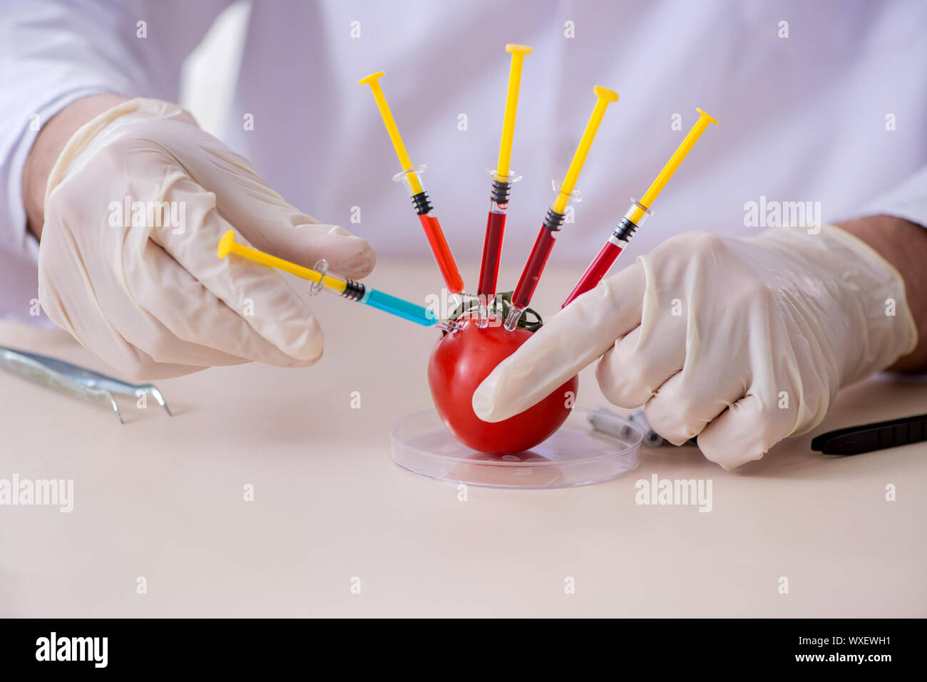 Male nutrition expert testing food products in lab Stock Photo - Alamy