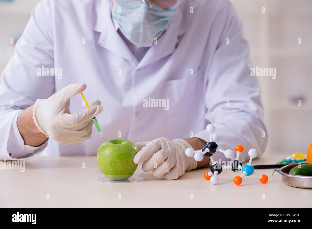 Male nutrition expert testing food products in lab Stock Photo - Alamy