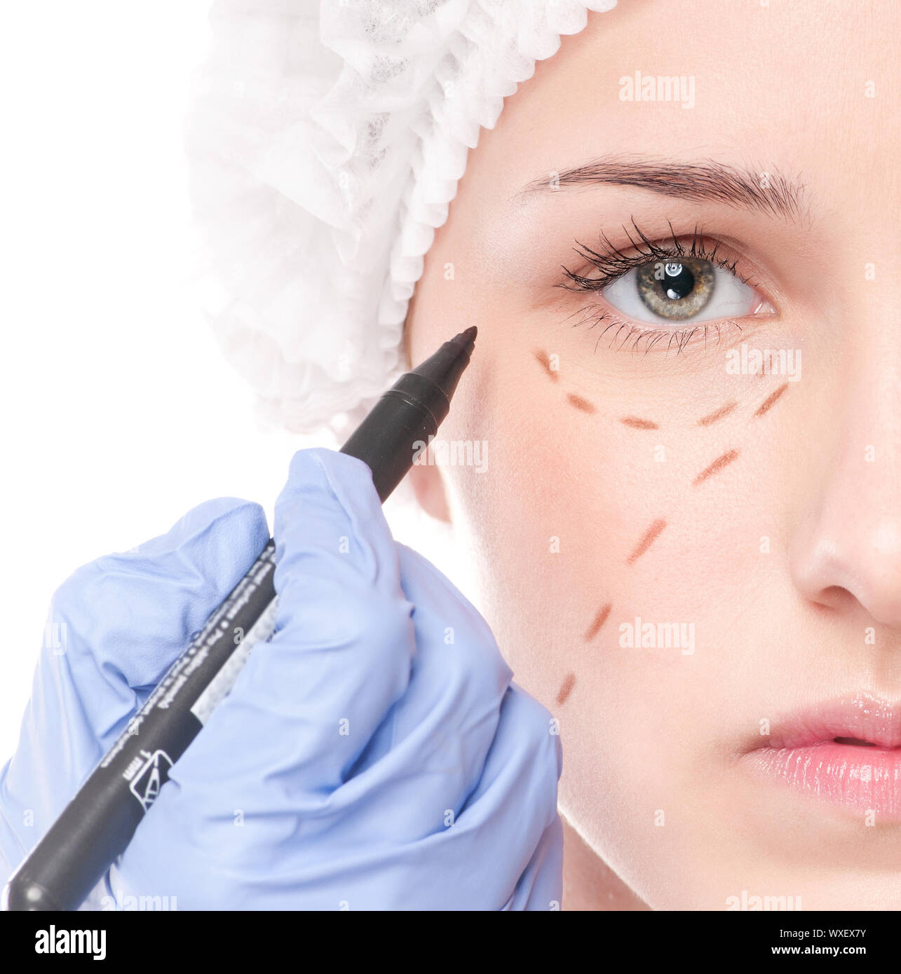 Beautician touch and draw correction lines on woman face. Before ...