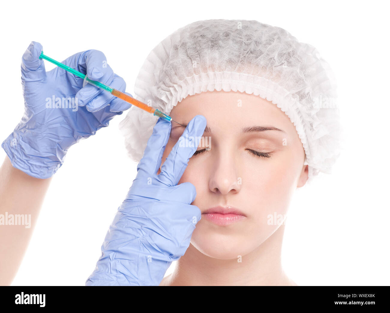 Cosmetic botox injection in the female face. Eye and eyebrow zone ...