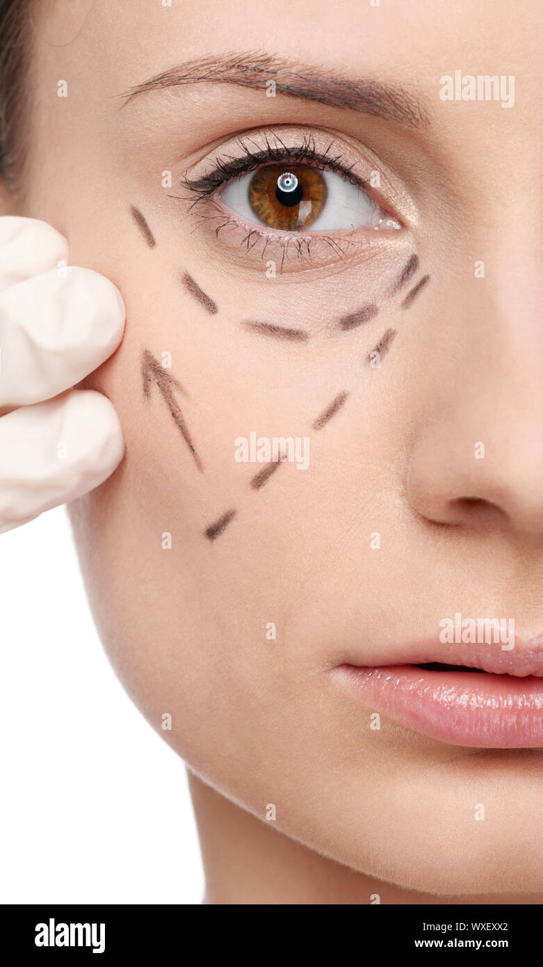 Beautician touch and draw correction lines on woman face. Before ...