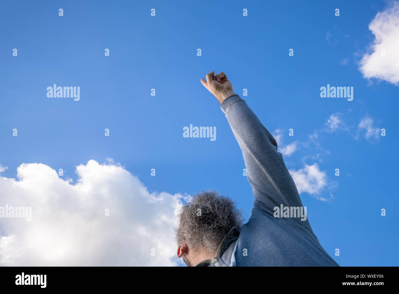 Person Pointing To The Sky