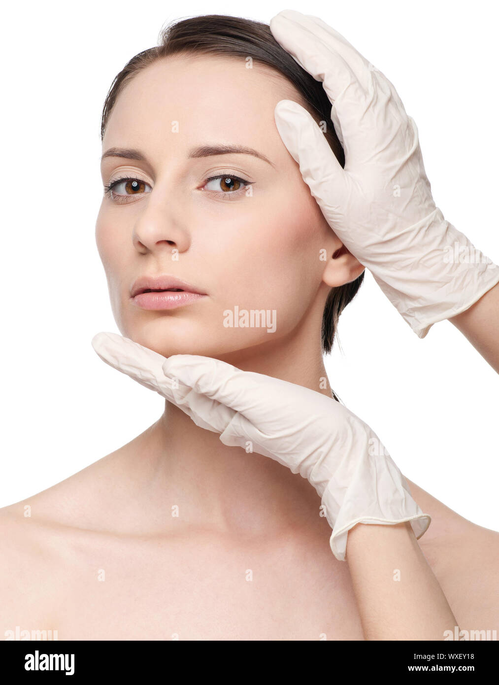 Beautician touch and exam health woman face. Plastic surgery. Isolated ...