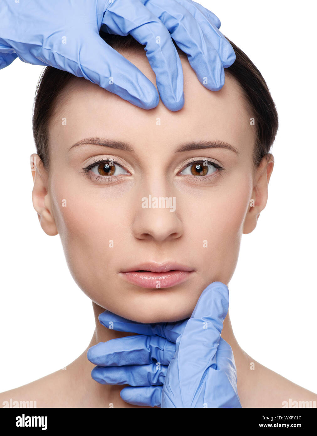 Beautician touch and exam health woman face. Plastic surgery. Isolated ...
