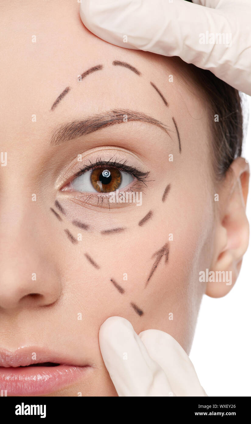 Beautician touch and draw correction lines on woman face. Before ...