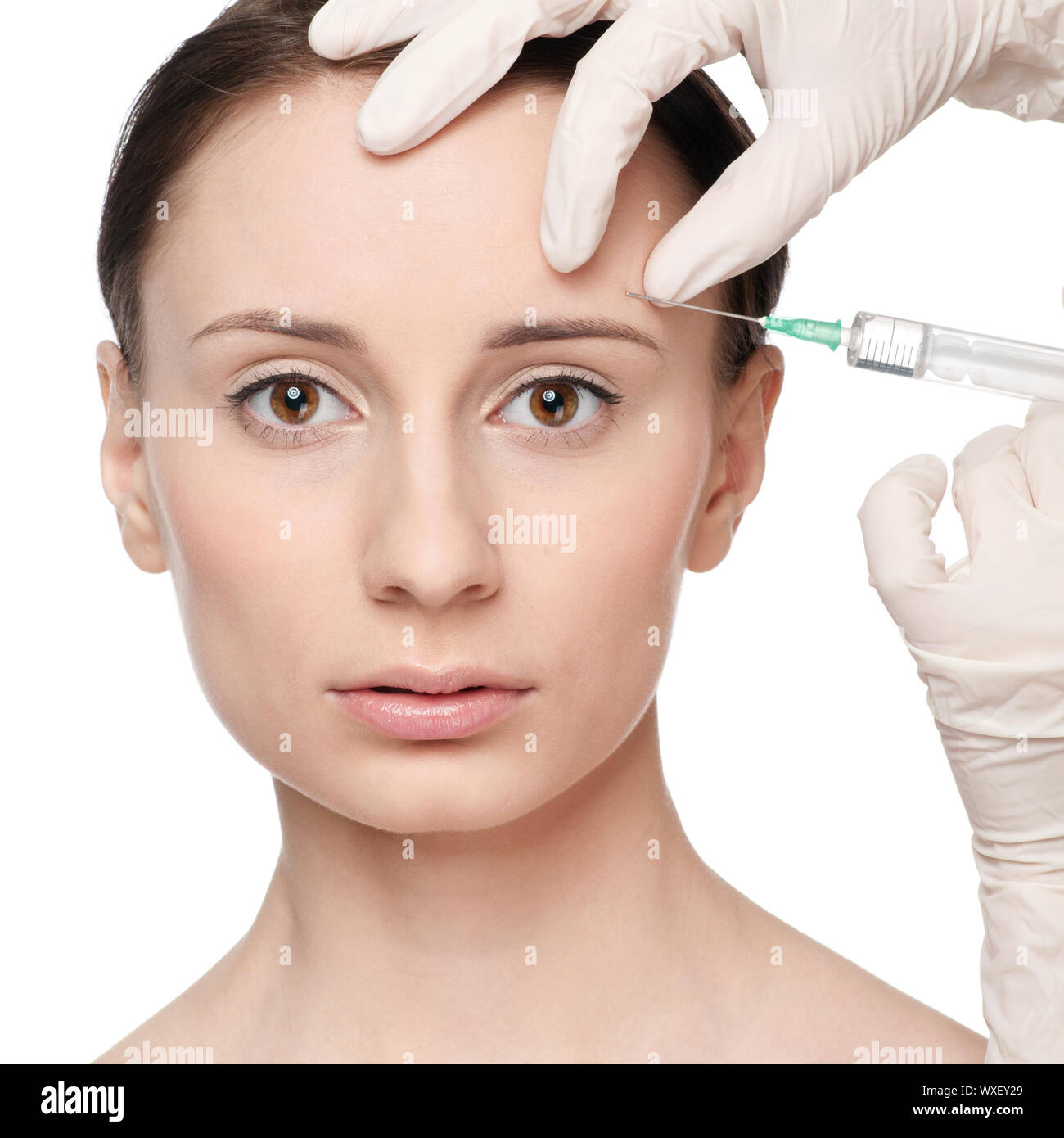Cosmetic botox injection in the female face. Eyebrow zone. Isolated ...