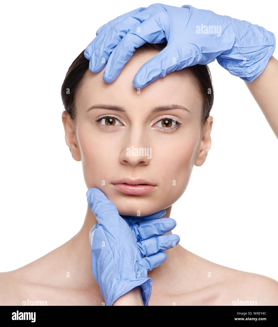 Beautician touch and exam health woman face. Plastic surgery. Isolated ...