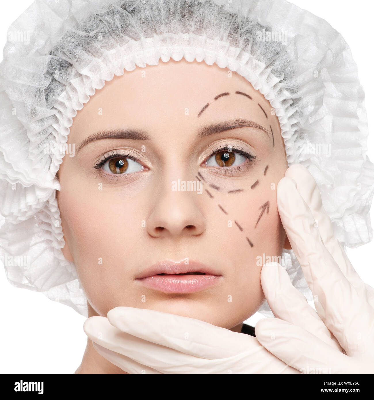 Beautician touch and draw correction lines on woman face. Before ...