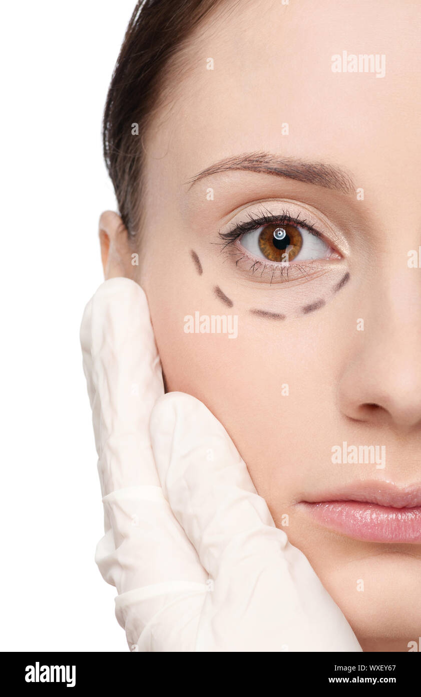 Beautician touch and draw correction lines on woman face. Before ...