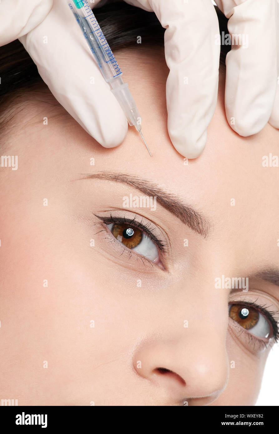 Cosmetic botox injection in the female face. Eyebrow zone. Isolated ...