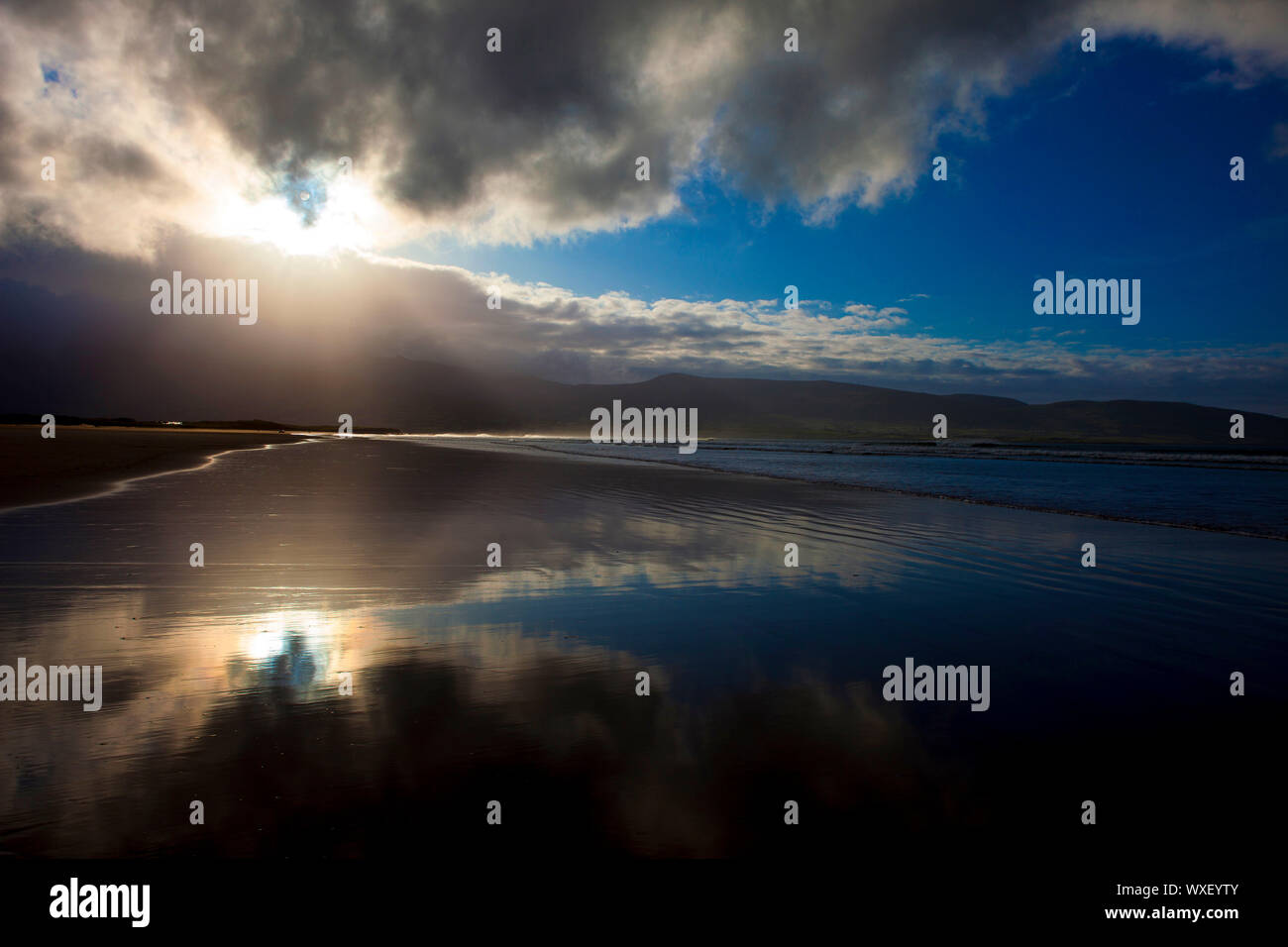 Reflctions of clouds on Fermoyle Beach, on the Dingle Peninsula ...