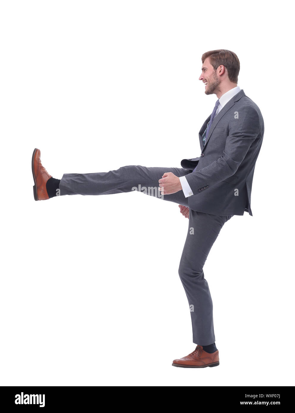 in full growth. smiling businessman pushing off the wall Stock Photo ...