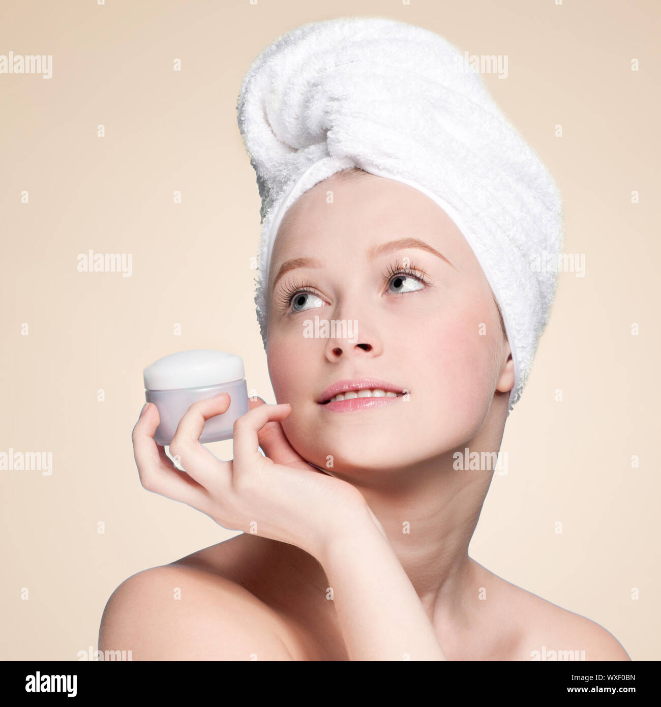 Beautiful woman tender jar of moisturizer cream. Close-up fresh young ...