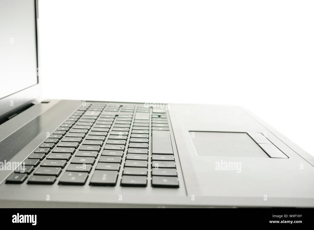 Closeup of laptop keyboard. Isolated over white background Stock Photo ...