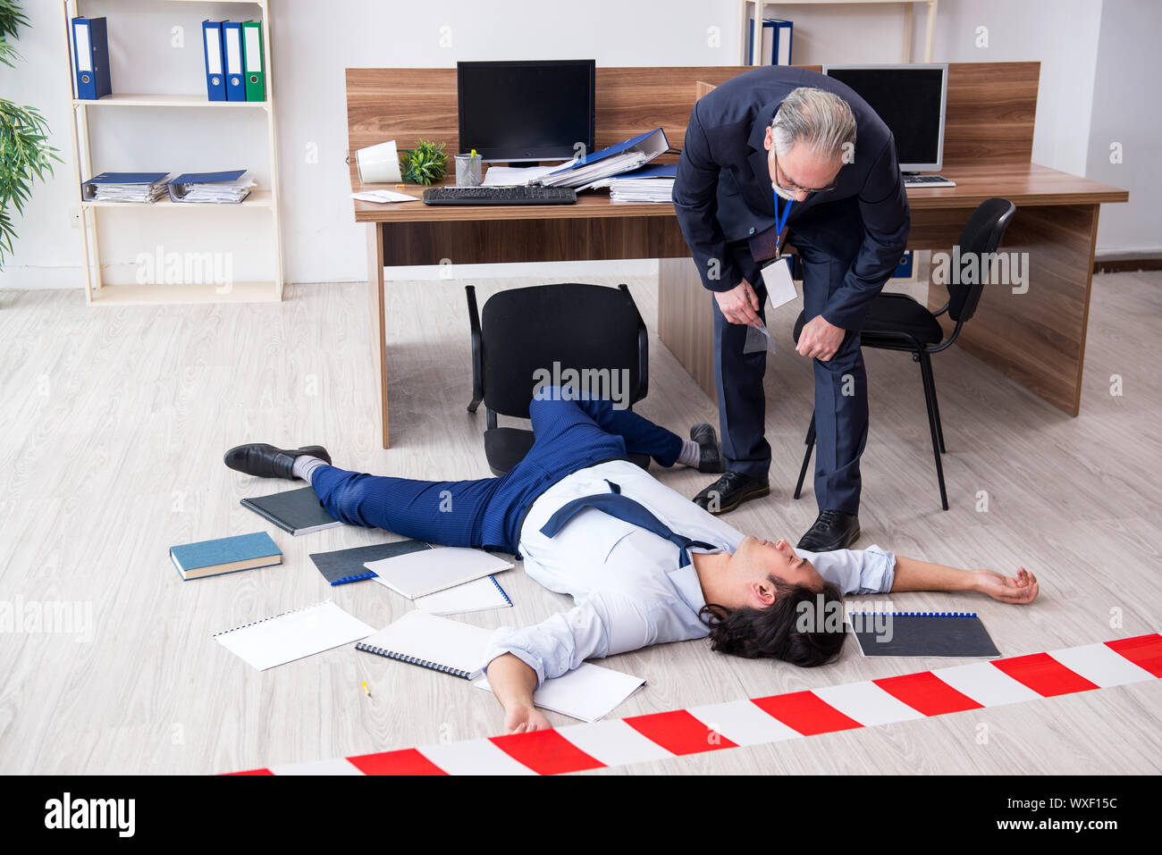 Forensic investigator and dead employee in the office Stock Photo - Alamy