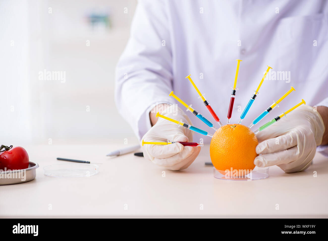 Male nutrition expert testing food products in lab Stock Photo - Alamy