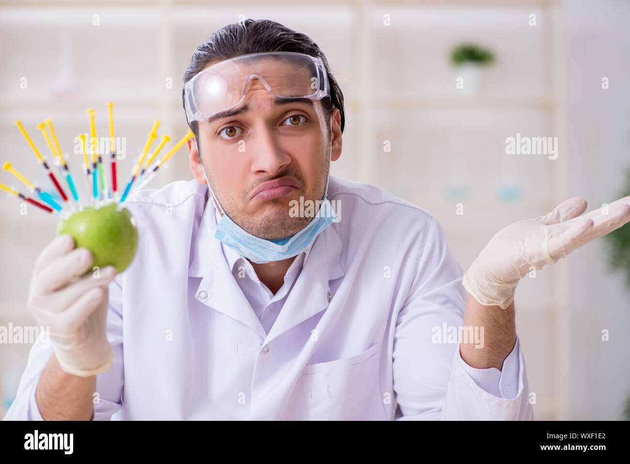 Male nutrition expert testing food products in lab Stock Photo - Alamy