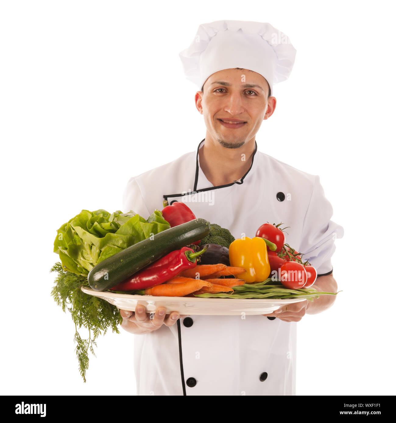 Cook with big assortment fresh vegetables isolated over white ...
