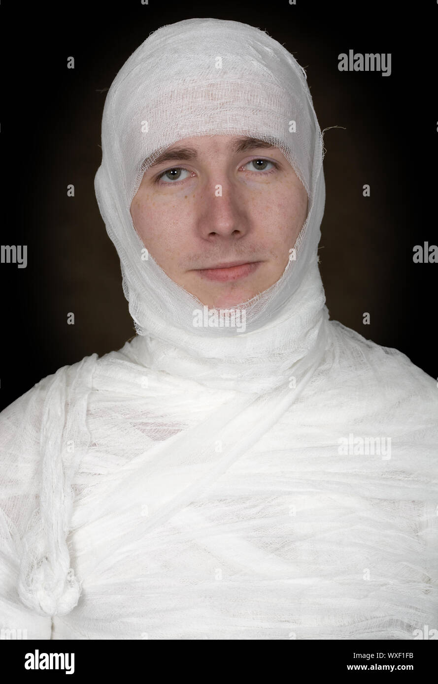 Portrait of totally bandaged sickly sad man Stock Photo - Alamy