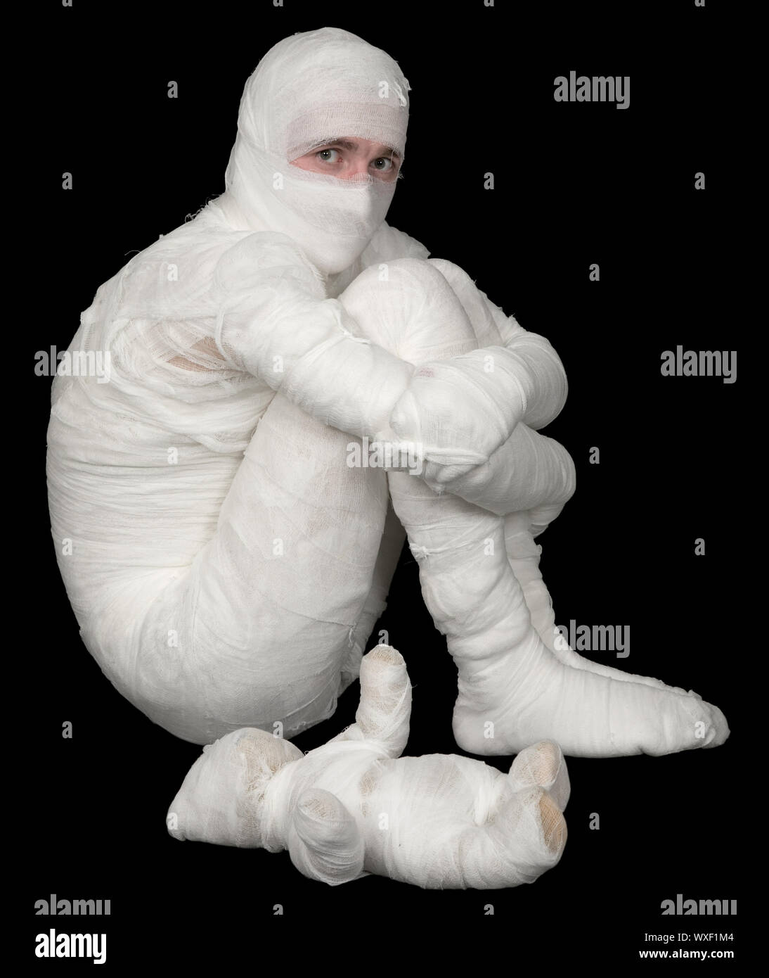 Egyptian mummy emo sitting on a black and mummy bear Stock Photo - Alamy