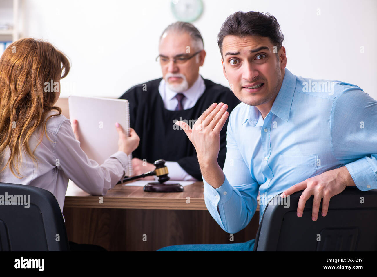Young couple in the courthouse in divorce concept Stock Photo - Alamy