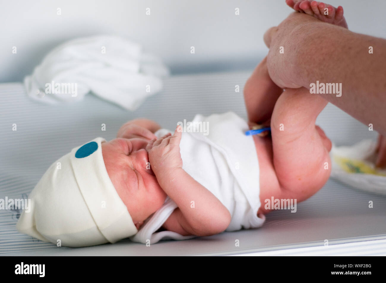 changing diper by the newborn boy Stock Photo - Alamy