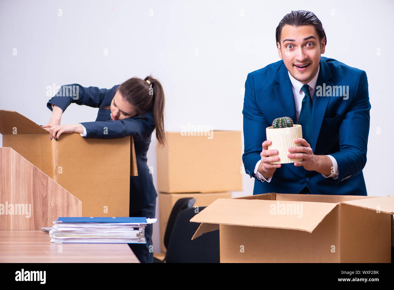 Two employees being fired from their work Stock Photo - Alamy