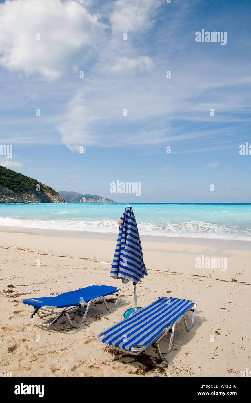blue empty sunbeds at the beach Stock Photo - Alamy