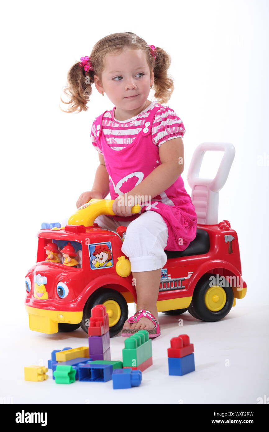 Girl on fire engine Stock Photo - Alamy