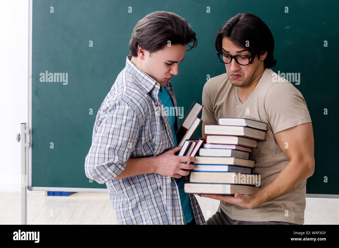 Two male students in the classroom Stock Photo - Alamy