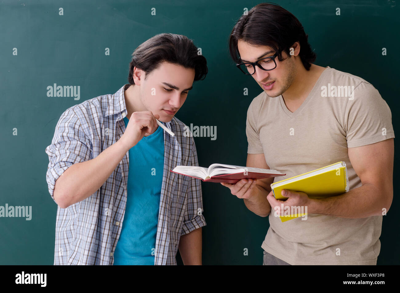 Two male students in the classroom Stock Photo - Alamy