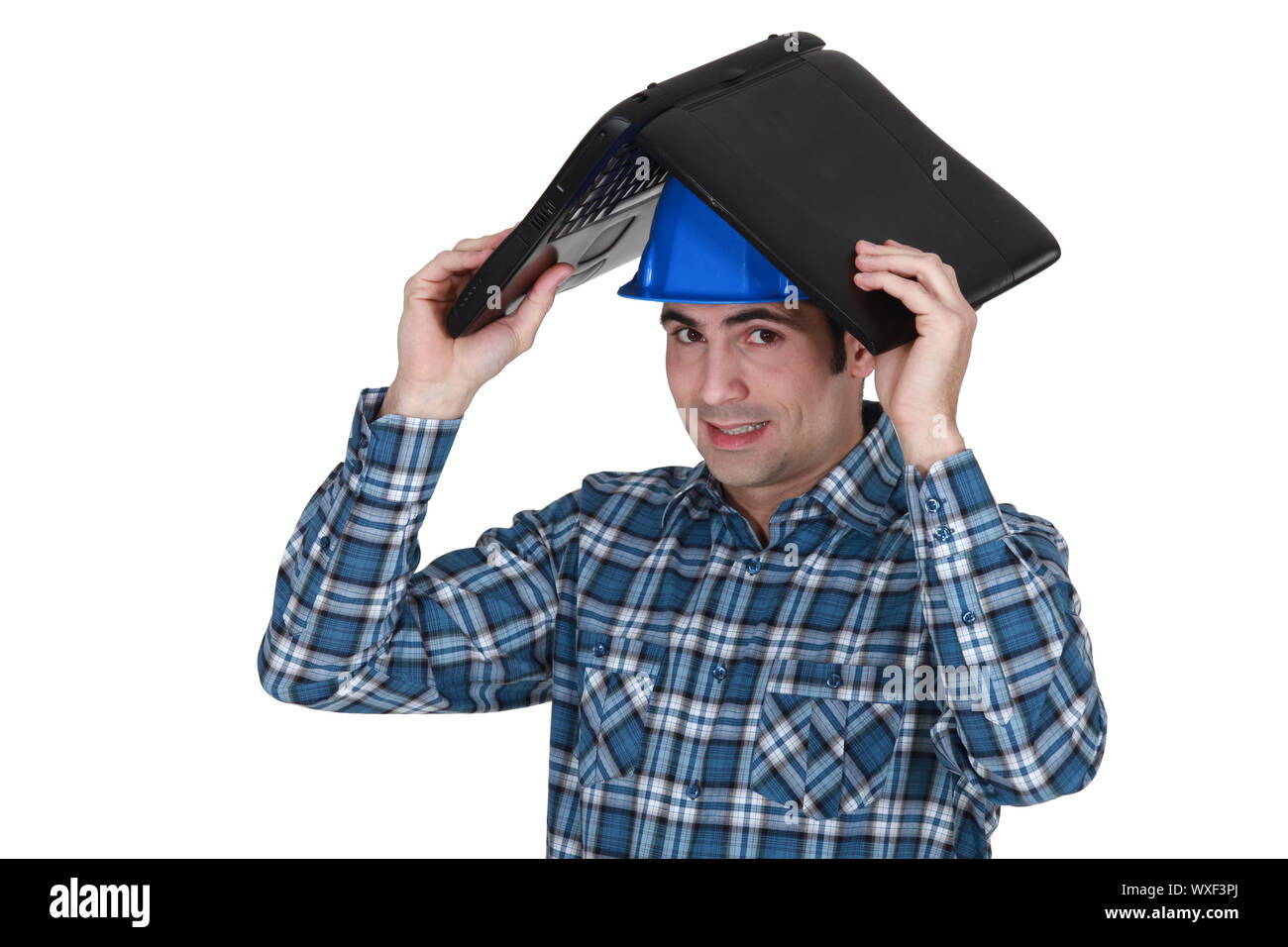 Manual worker holding computer Stock Photo - Alamy
