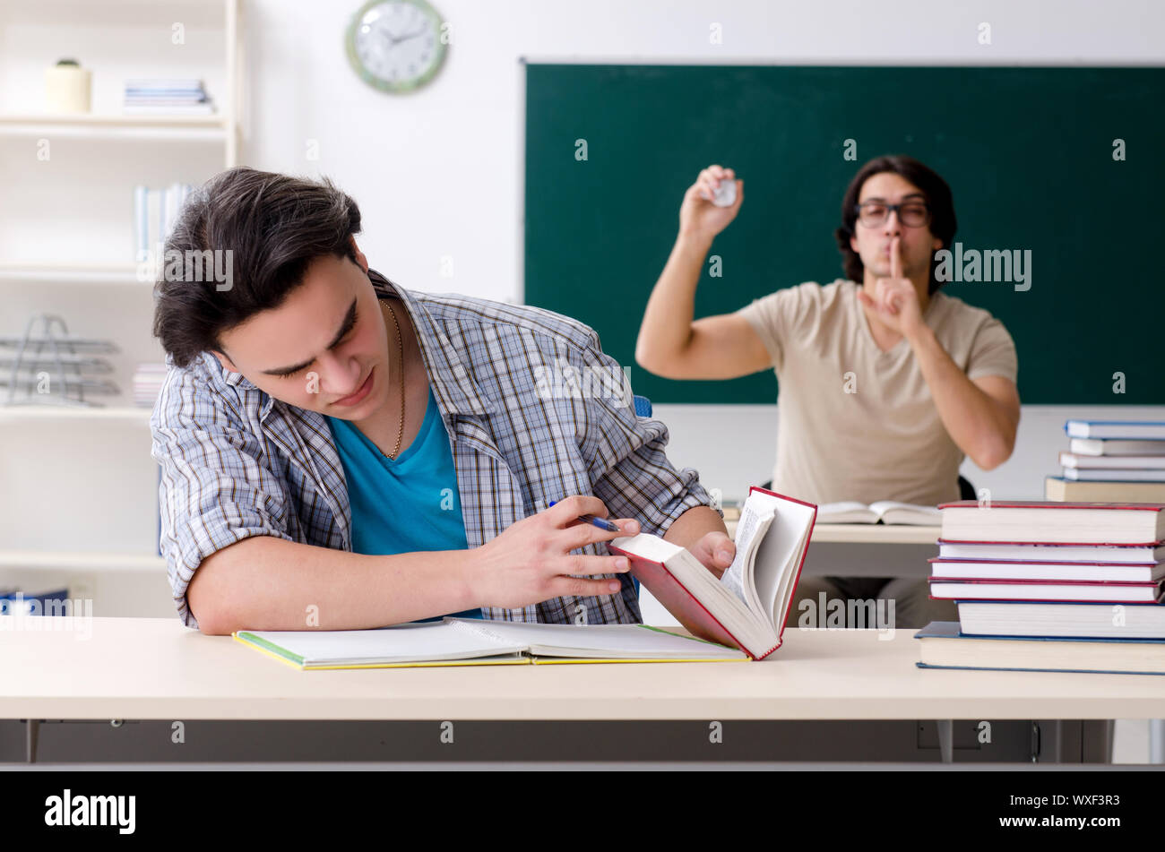 Two male students in the classroom Stock Photo - Alamy