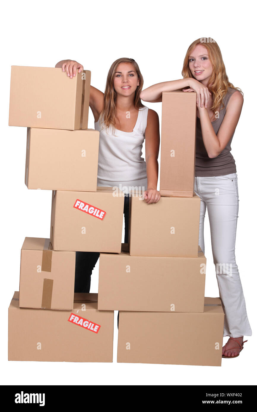 Girls surrounded by boxes Stock Photo - Alamy